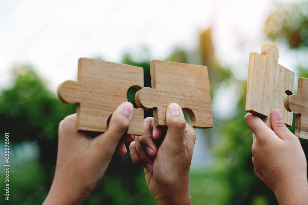 Jigsaw puzzle in hand, teamwork together communication puzzle piece ...