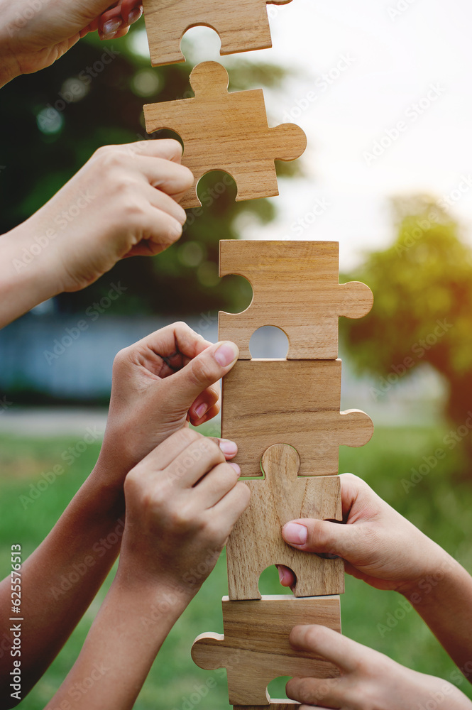 Jigsaw puzzle in hand, teamwork together communication puzzle piece ...