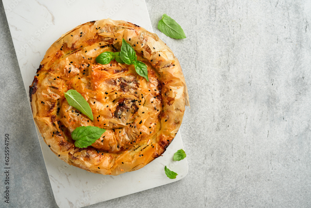 Delicious pie Spanakopita with soft feta cheese and spinach on old gray ...