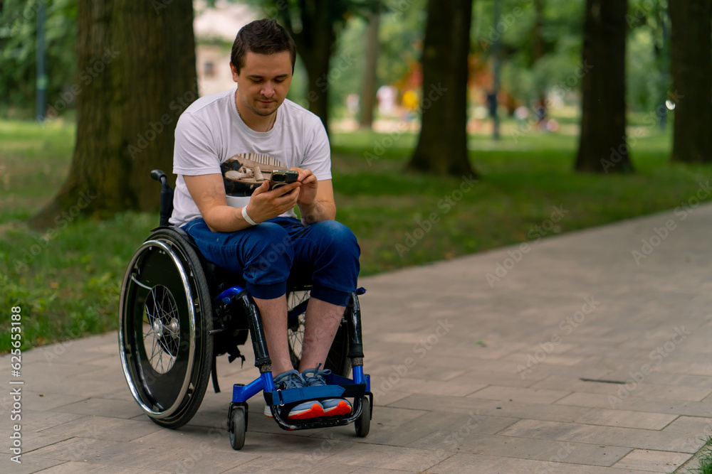 Inclusiveness Focused A man with disabilities in a wheelchair stares ...