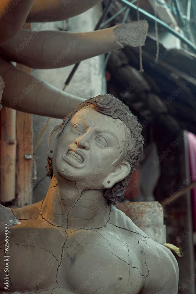 clay made idol of demon Mahishasura who fights with Hindu Goddess Durga ...