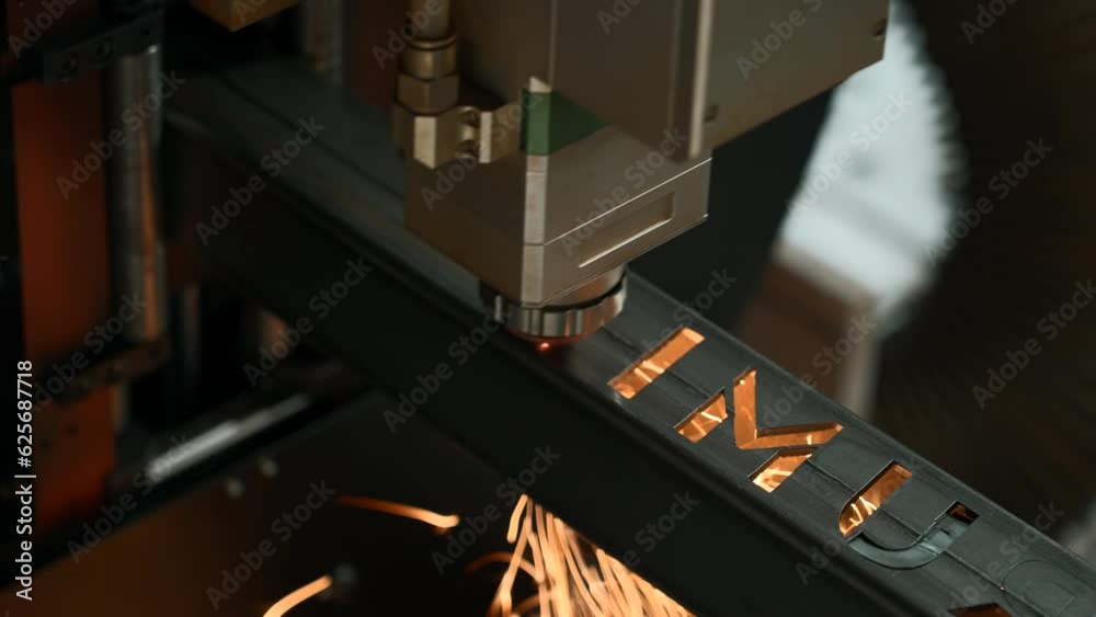 Laser cut head machine while cutting the sheet metal with the sparking ...