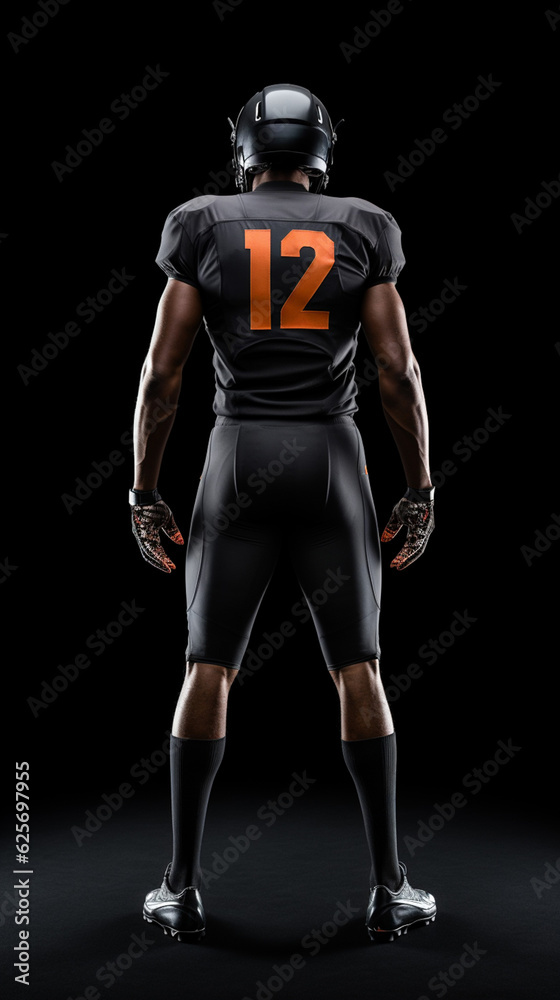 rear view of american football athlete in blue uniform standing in ...