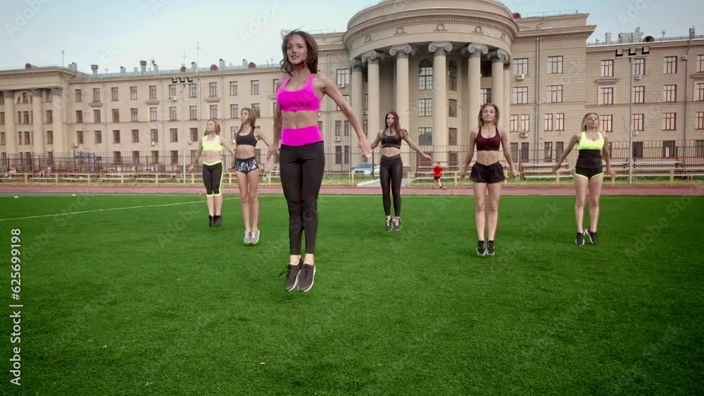 Vidéo Stock Group of cheerleaders in action. Concept of unity and team ...