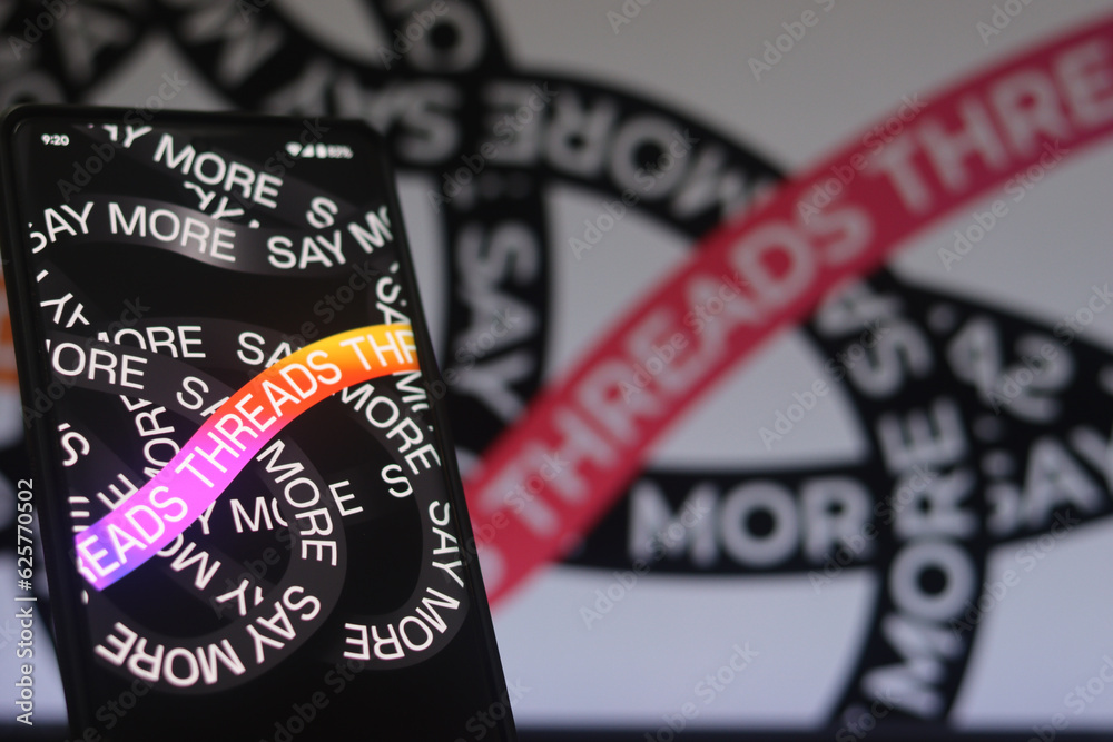 The threads logo is displayed on a smartphone screen. Threads new social network and messaging ...