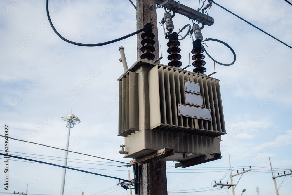 High-voltage transformers are installed on large pylons. Stock Photo ...
