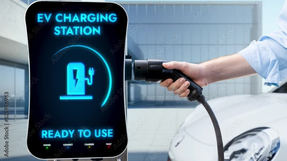 Hand pull EV charger from smart electric charging station display ...