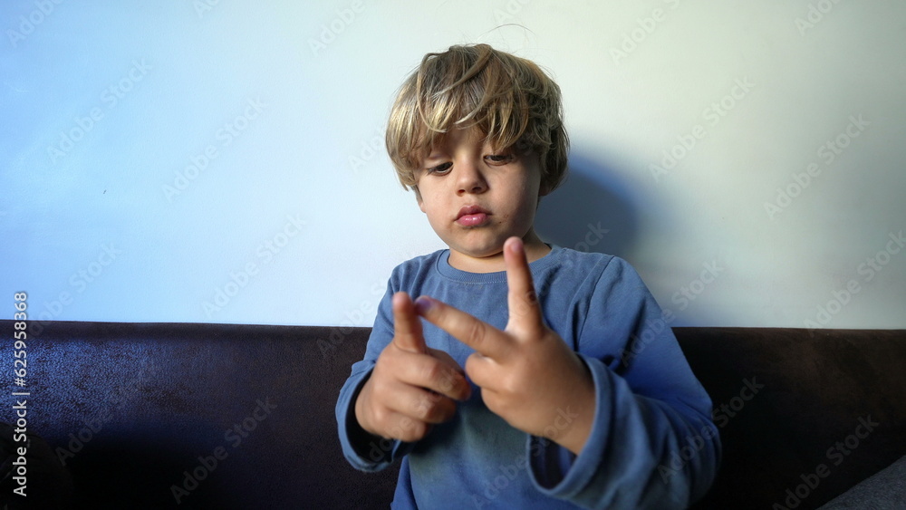 Little boy learning to count with fingers child development Stock Photo ...