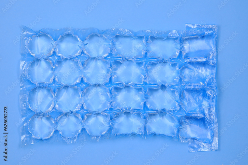 Plastic bag with water for ice close-up. Blue plastic packaging ice ...
