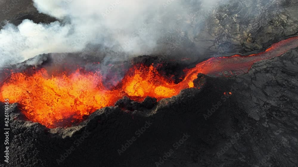 Volcano eruption, red hot burning lava erupts from ground, drone fly ...