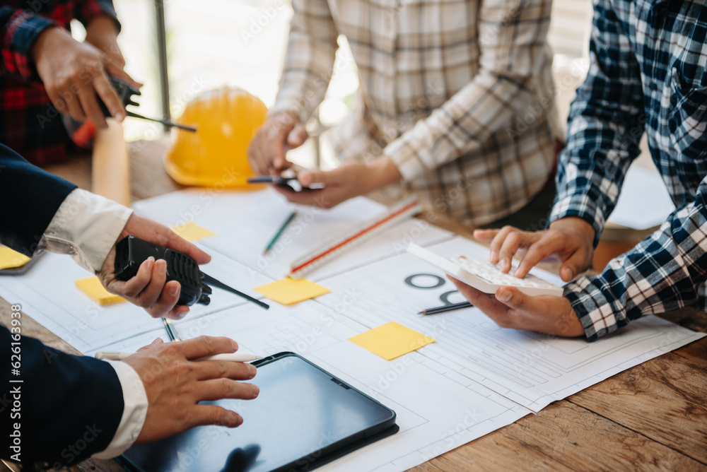 Engineer teams meeting working together wear worker helmets hardhat on ...