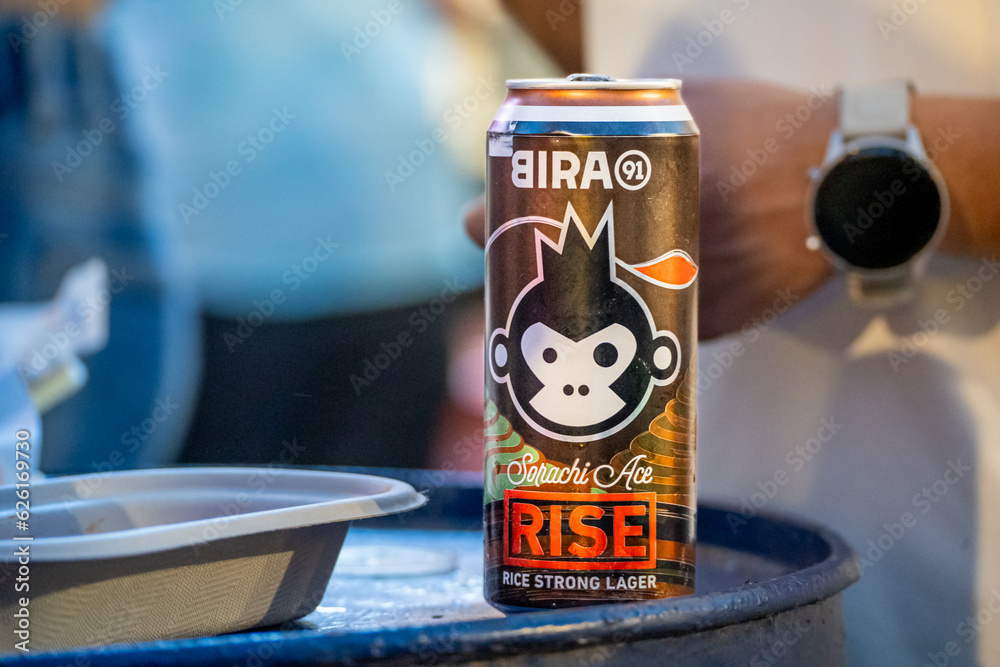 Can of Bira rise beer placed on top of a table in an outdoor venue ...