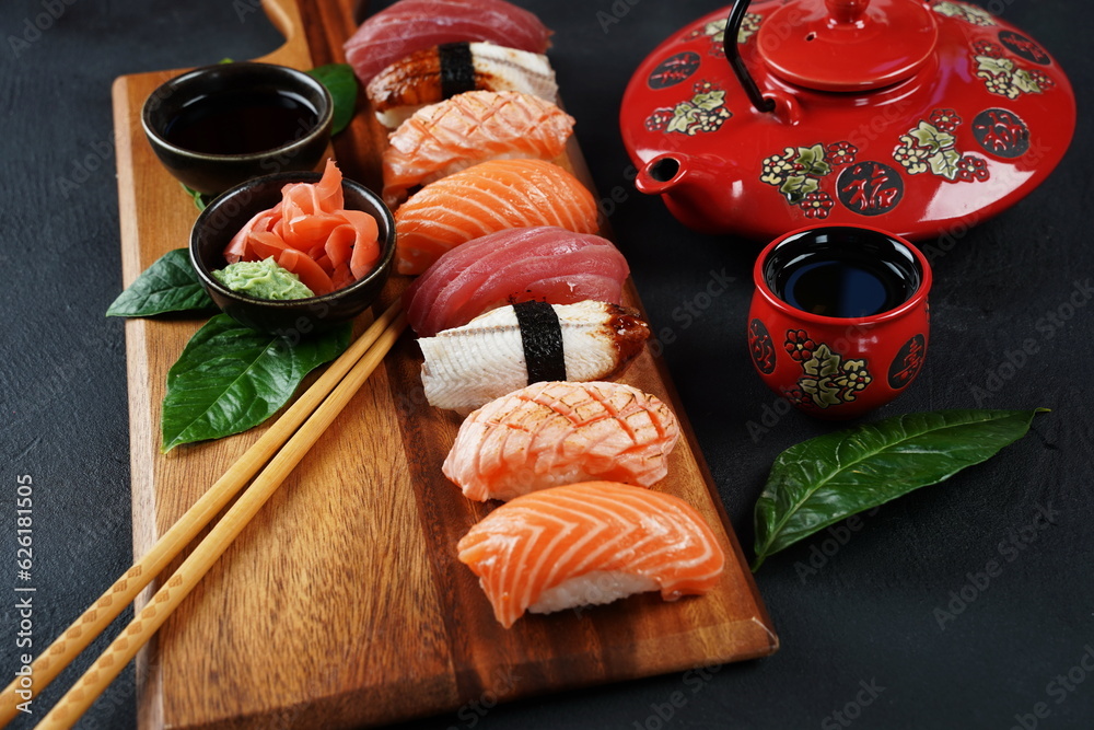 Japanese traditional Cuisine - Set of Nigiri sushi topped with sake ...
