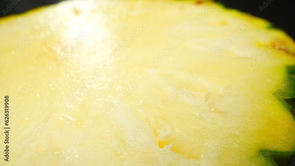 Macro video of a Pineapple slice. Shot with a probe lens, witness the ...