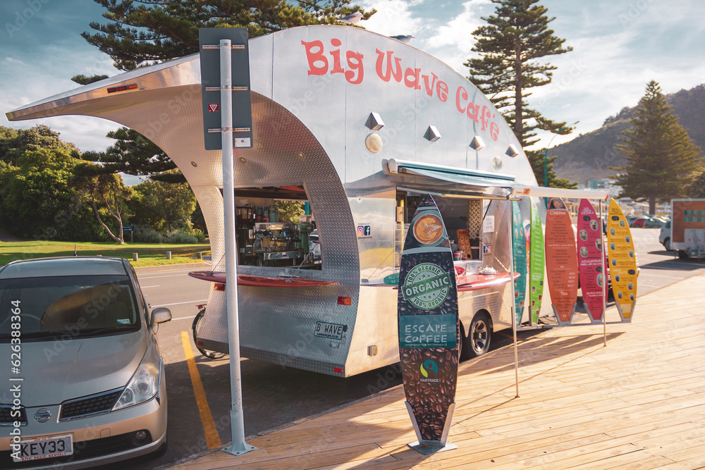 Mobile surf cafe stylized as a wave with a billboard in the form of a ...