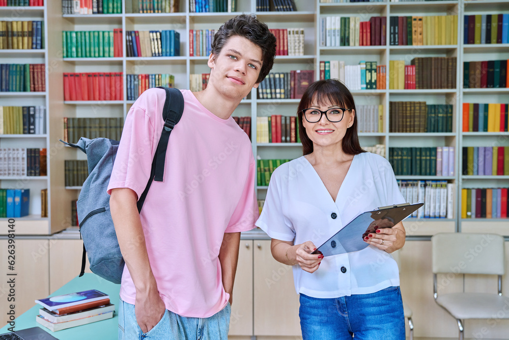 Middle-aged female teacher mentor talking to male college student, young 18-20 year old guy ...