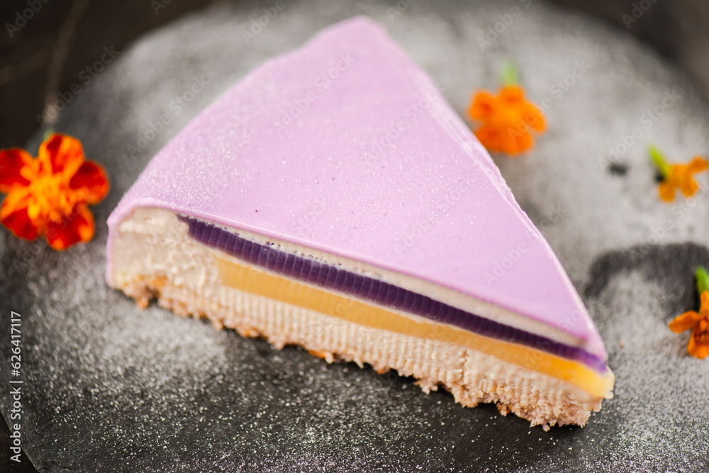 A slice of Gourmet Ube Entremet Cake also known as purple yam with ...