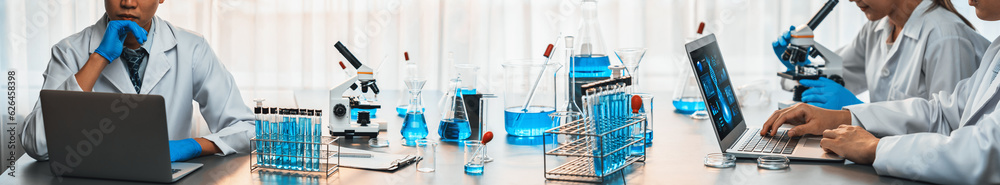 Group of dedicated scientist conduct chemical experiments and research ...