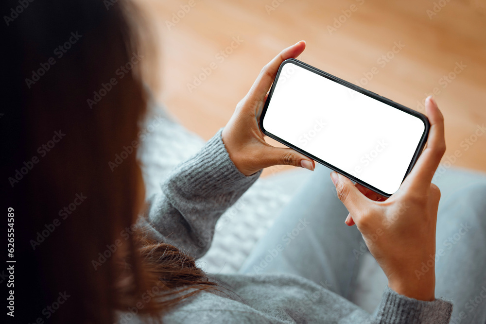 Closeup - Happy young woman holding mobile smartphone with blank white ...