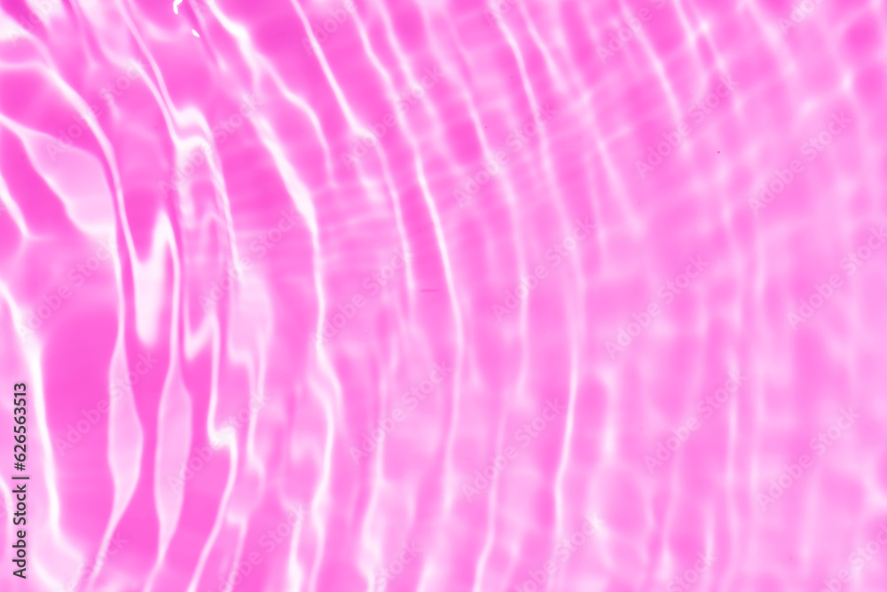 Pink water with ripples on the surface. Defocus blurred transparent ...