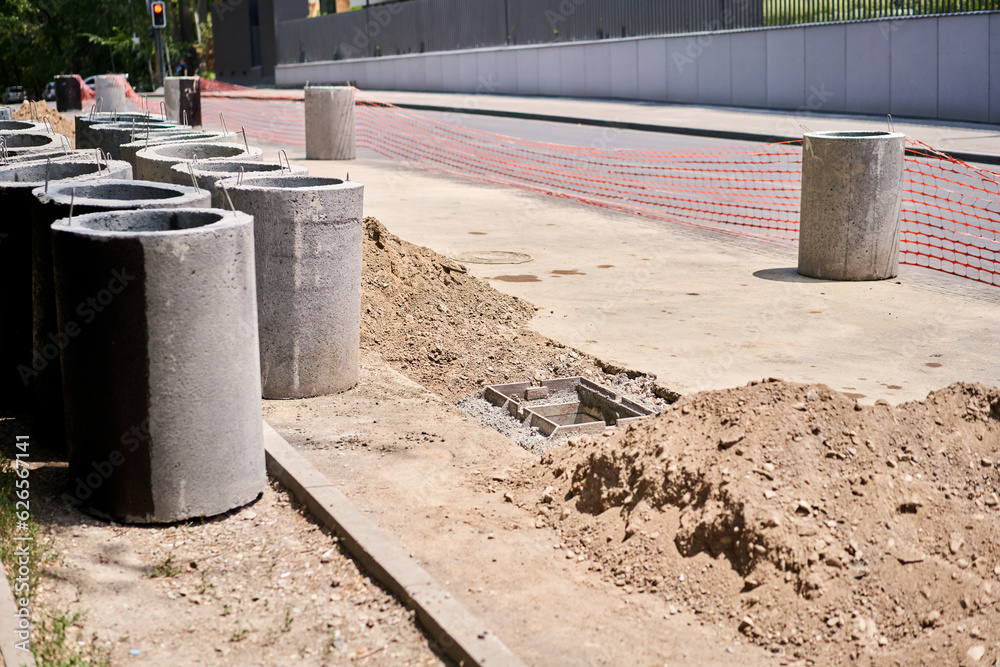 Laying concrete manholes and drain pipes for stormwater system ...
