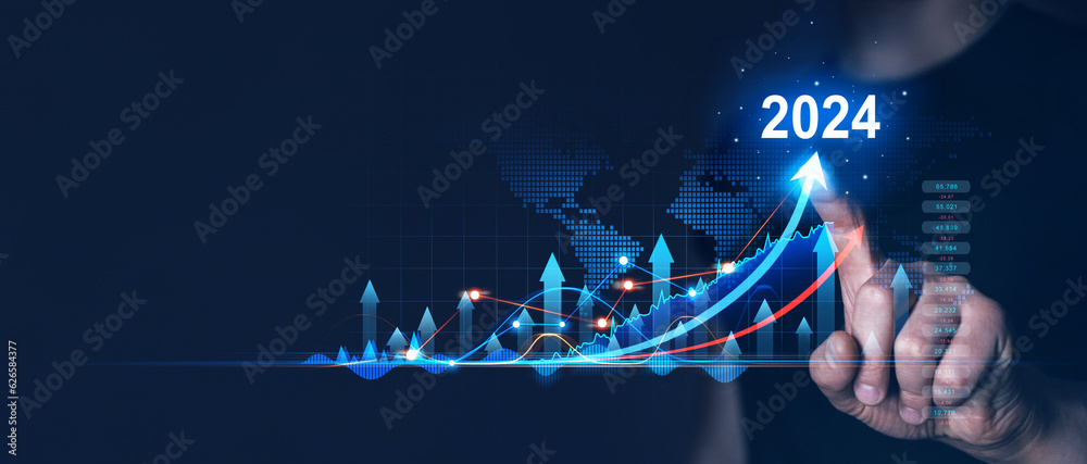 Businessman holding growth graph a year 2024 of business and data ...