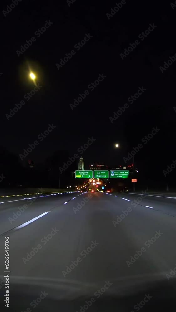 Vertical night driving view of Downtown and 101 interchange highway ...