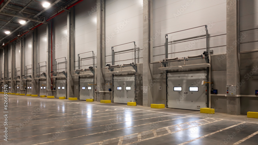 truck at loading ramps of a warehouse. Delivery logistics concept ...