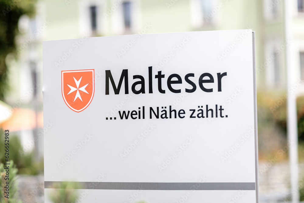 Passau, Bavaria, Germany - 2023 July 23: Sign with Malteser logo and ...