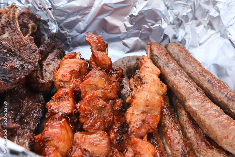 South African braai with boerewors, lamb chops and chicken kebabs in ...