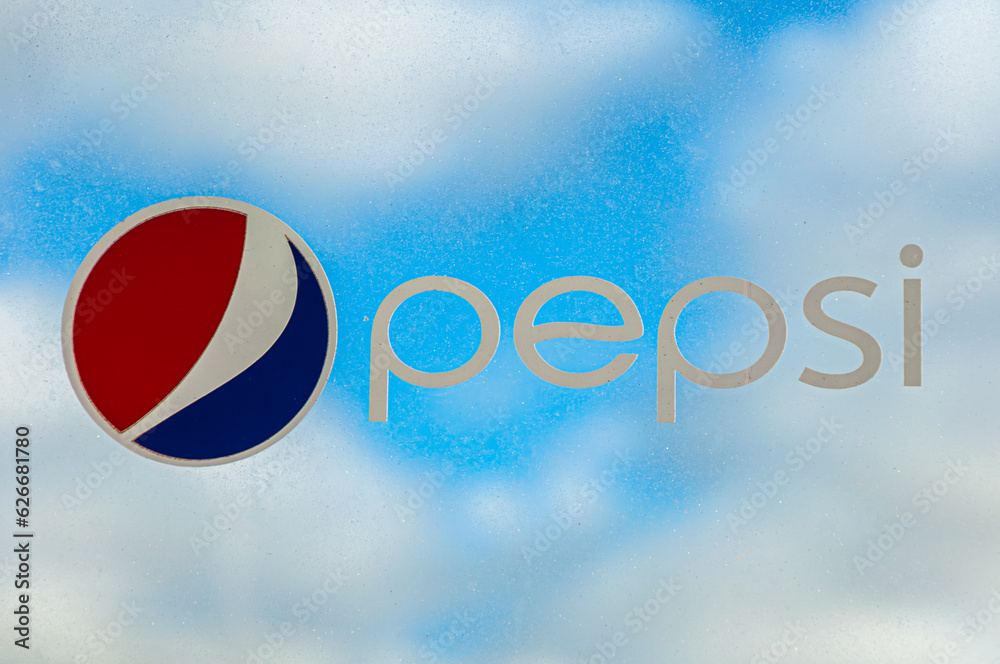 Pepsi logo and letters stuck on a glass sprinkled with sea salt, and ...