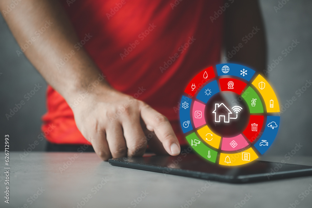 Smart home control concept hand touch icons screen with the tablet ...