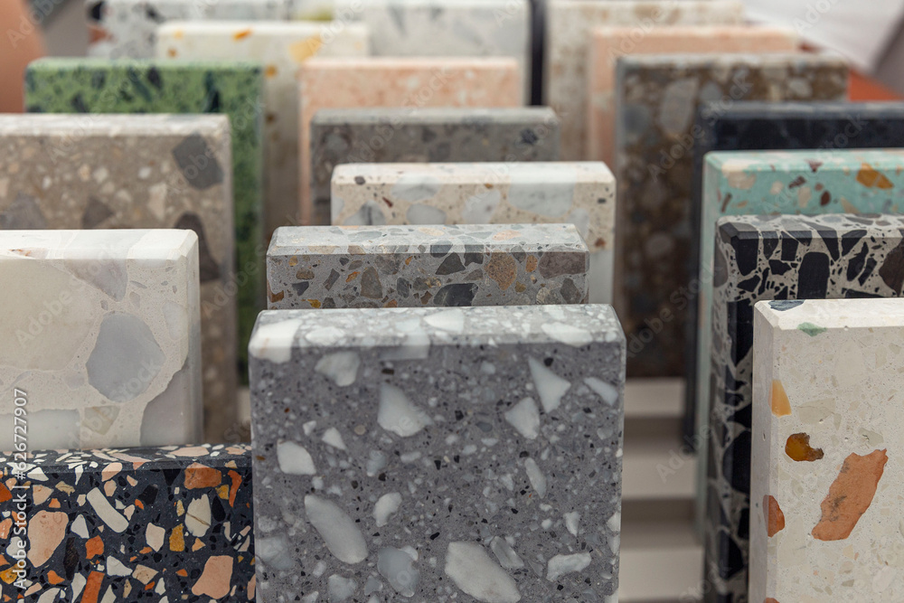 Samples of artificial stone on the table. Construction, renovation and ...