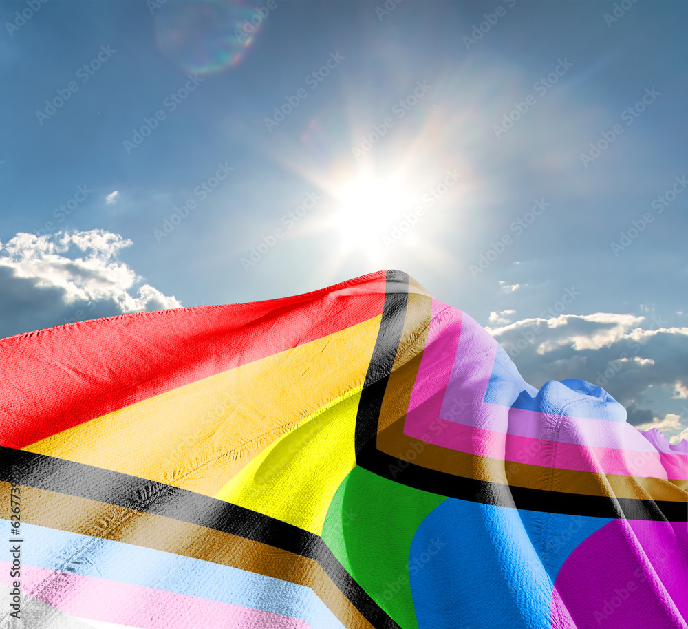 Bi Inclusive Unity flag waving in the wind at cloudy sky. Freedom and ...