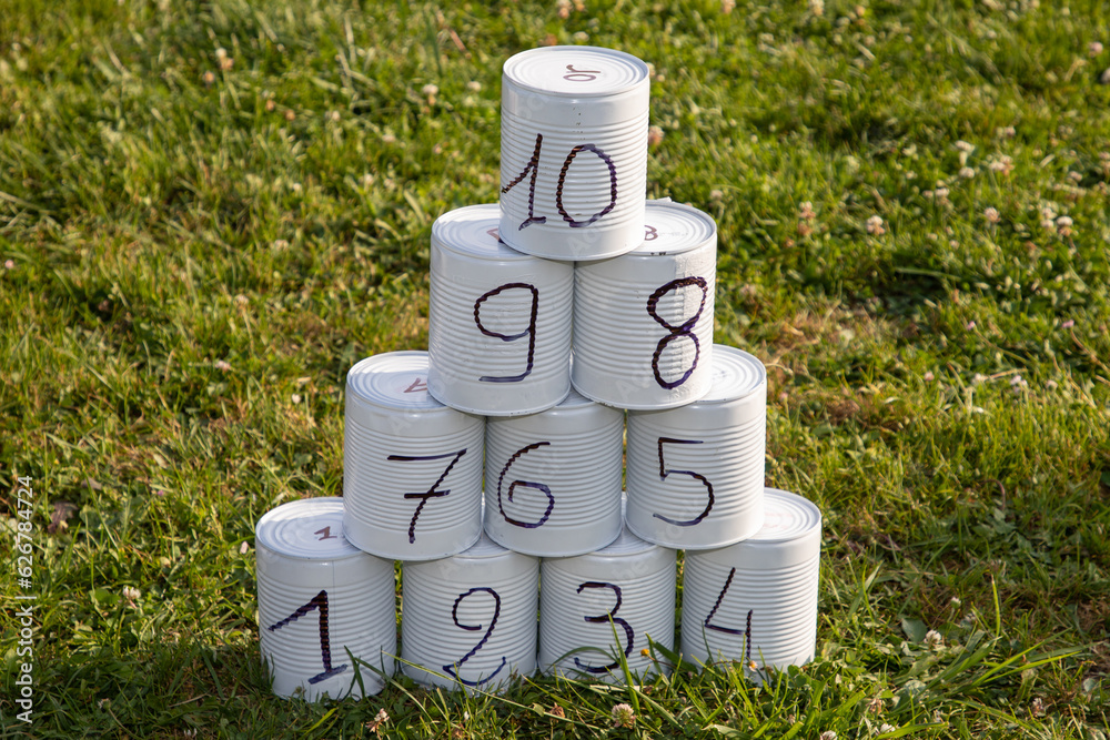 stacked tin can pyramid game for can knockdown games at funfair Stock ...