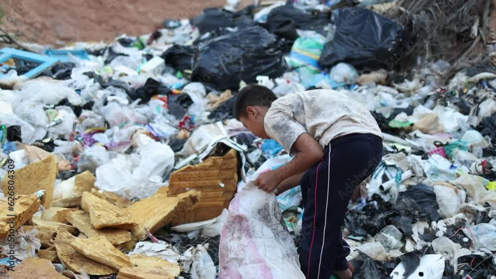 Child labor. Children are forced to work on rubbish. Poor children ...