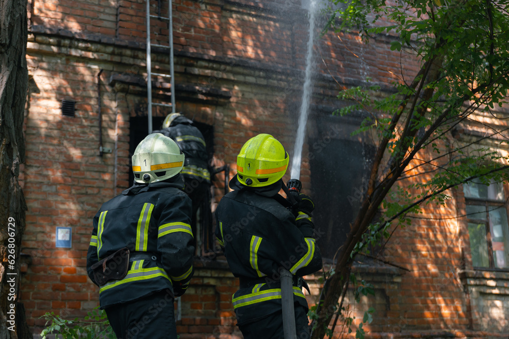 Ukrainian rescuers put out a fire in the house. Firefighters put out ...