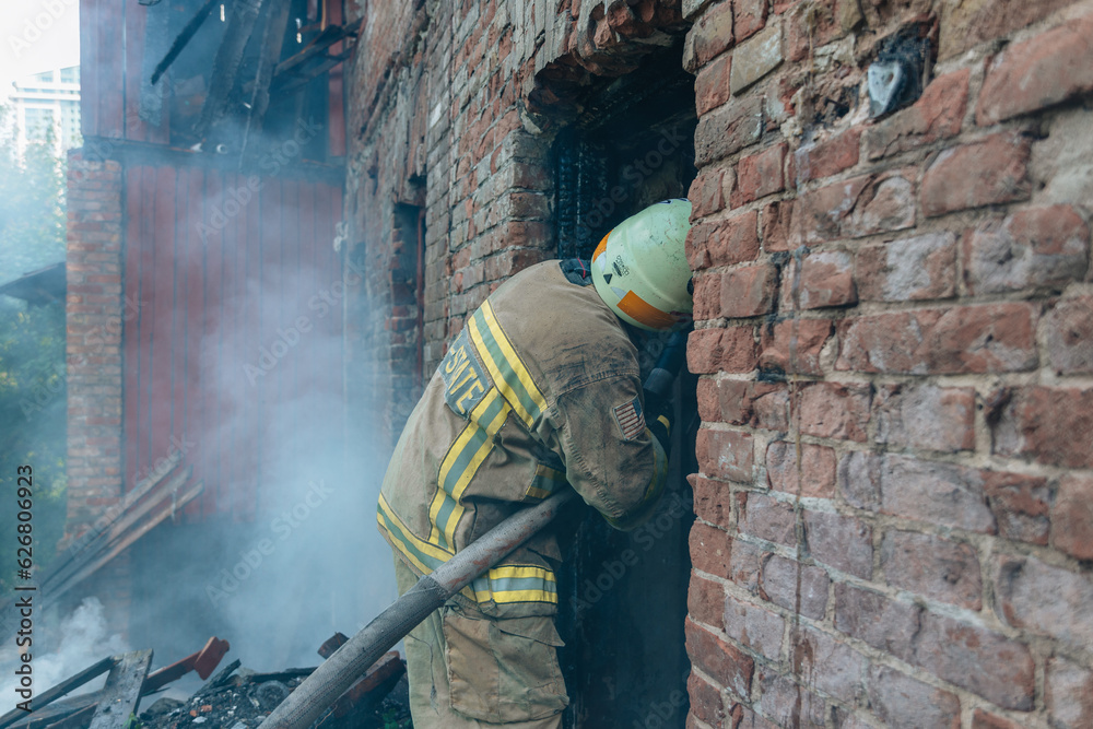 Ukrainian rescuers put out a fire in the house. Firefighters put out ...