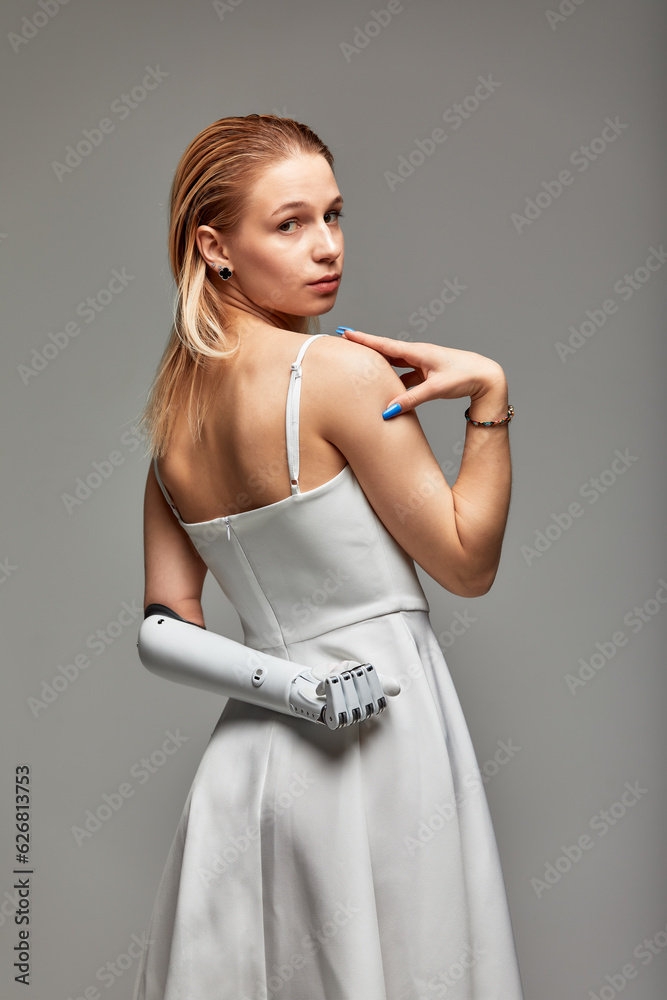 Studio portrait of young girl with disability wearing sensory bionic ...