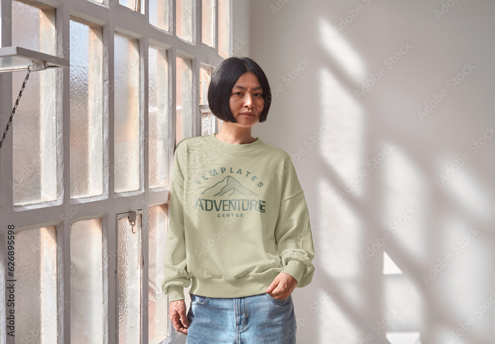 Mockup of Japanese woman wearing customizable long sleeve top by window ...