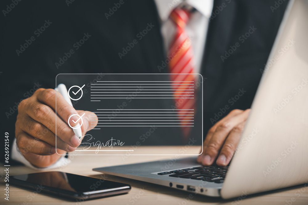 Businessman embraces electronic signature concept, signing electronic ...