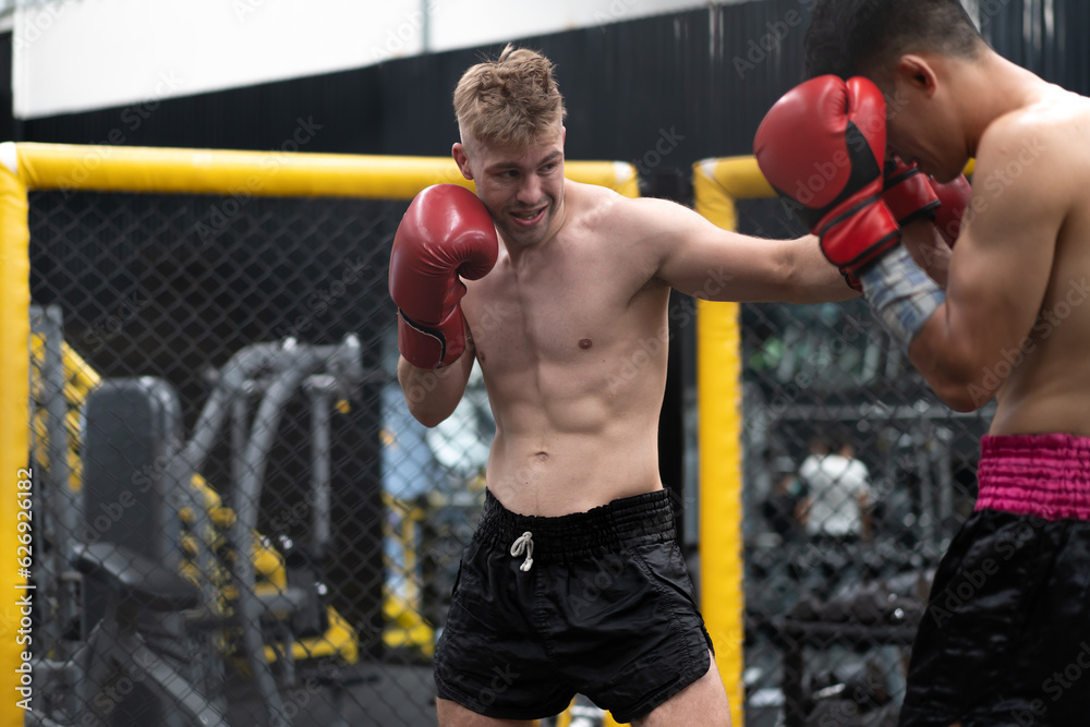 Two male athlete boxing competition in MMA ring. Diverse ethnic men ...