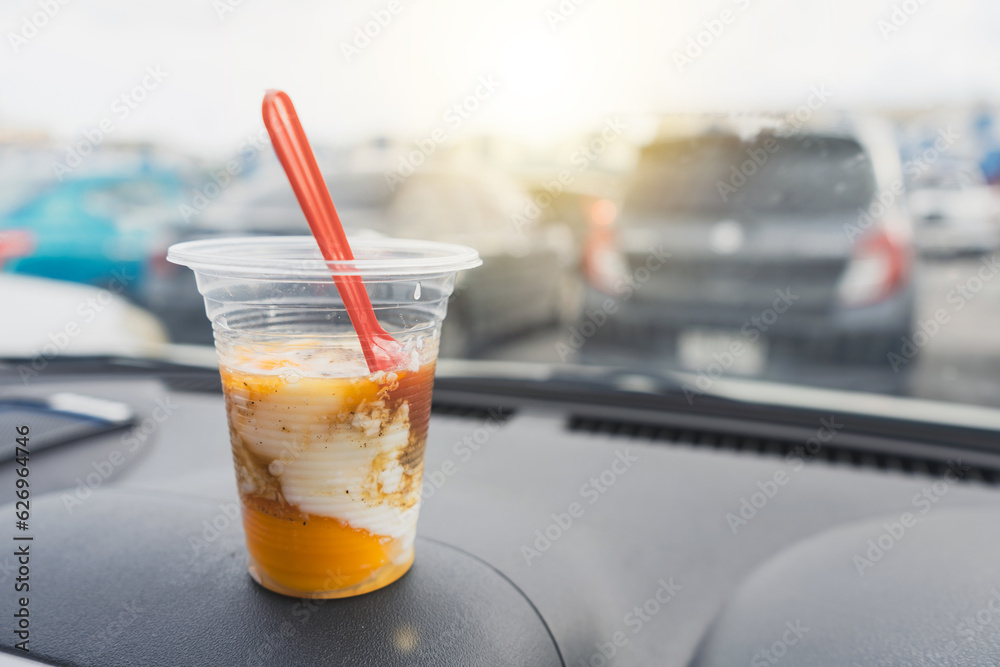 Hard-boiled eggs in plastic cup ready to eat in the car from the shop ...