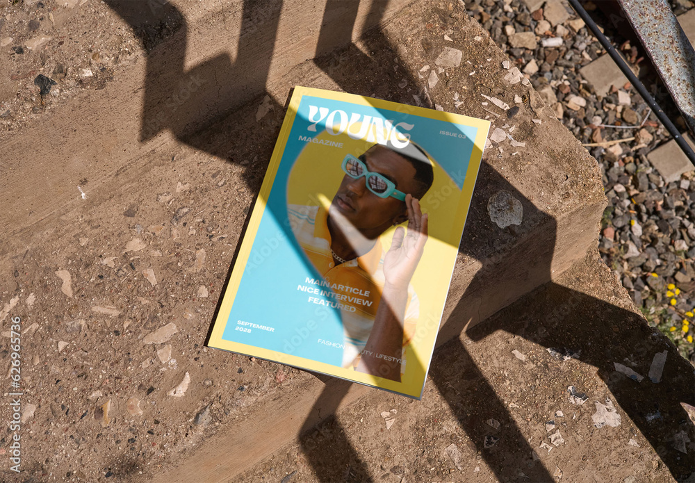 Mockup of vertical A4 magazine with customizable front cover on step ...