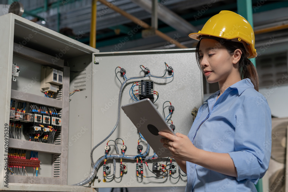 Mechanic or maintenance or electrical engineer checking main electrical ...