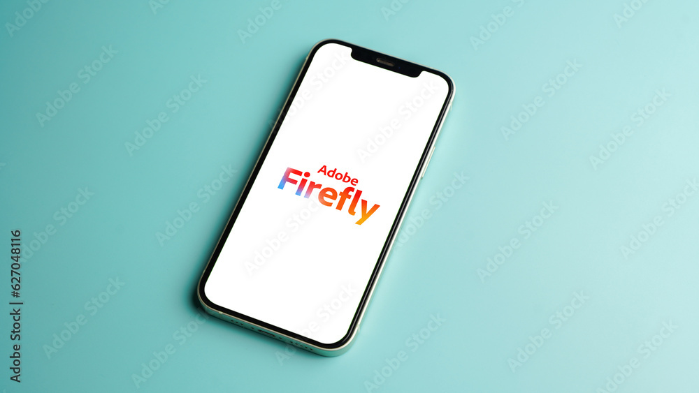 Adobe Firefly logo displayed on mobile phone screen, AI Art generator ...