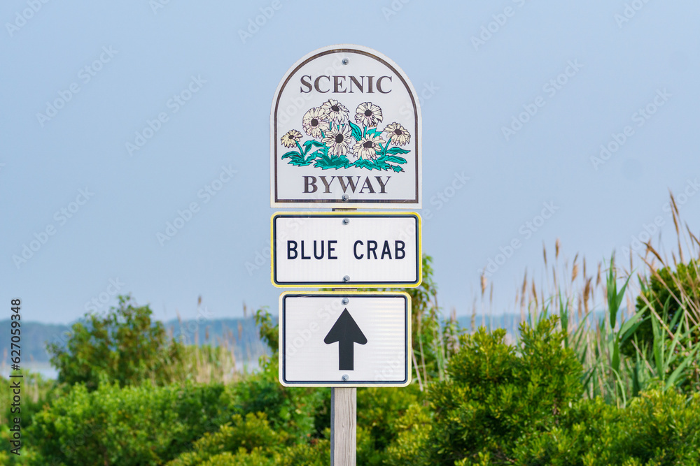 Road sign with arrow and blue crab message, Maryland scenic byway Stock ...