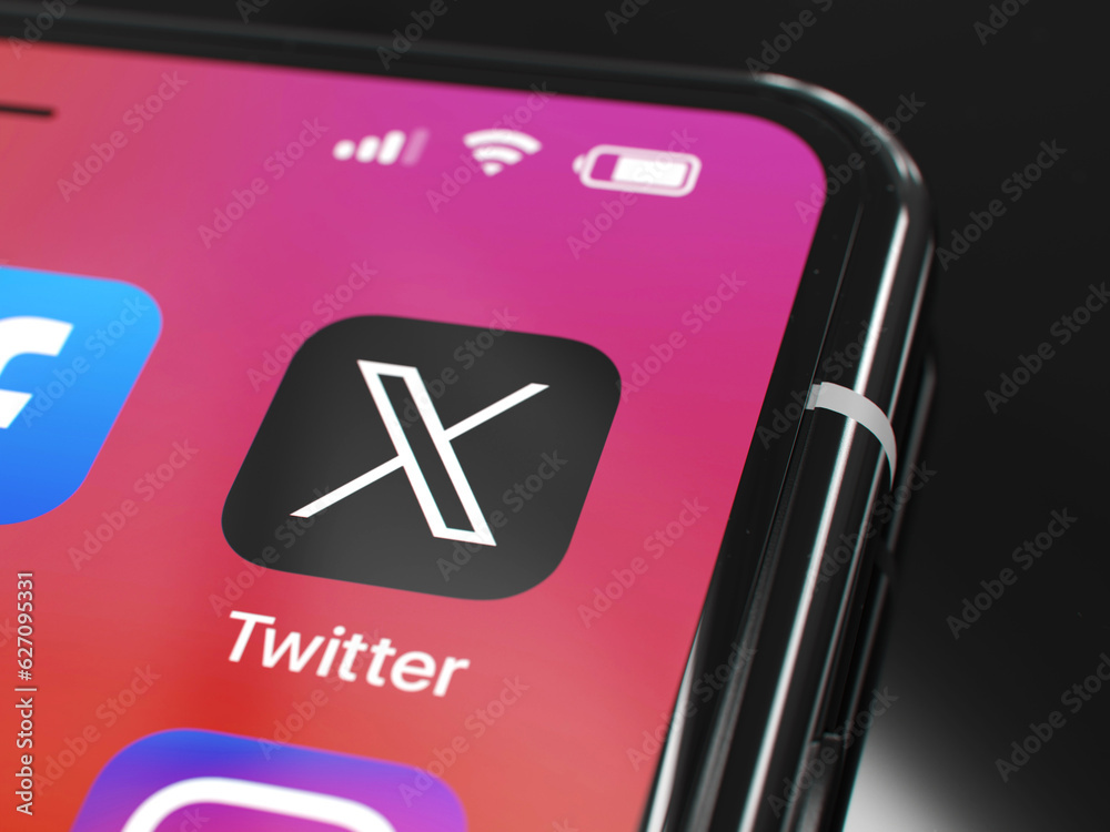 The new Twitter app icon in the form of an X on a smartphone screen ...