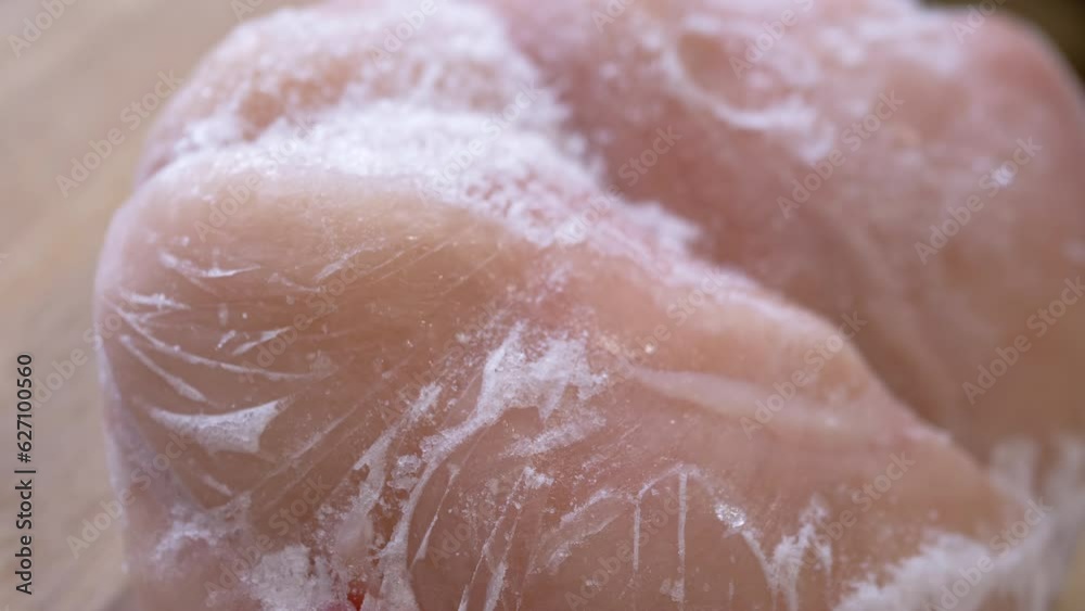 Large Piece of Frozen Meat Covered with an Ice Crust on a Rotating ...