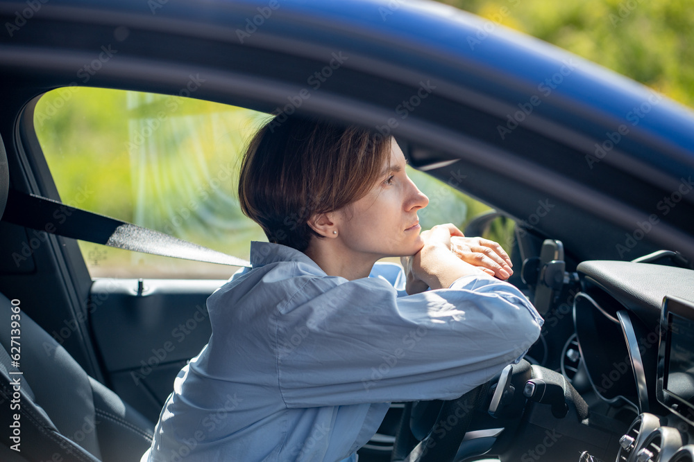 Pensive serious woman standing in traffic jam waiting driving car ...